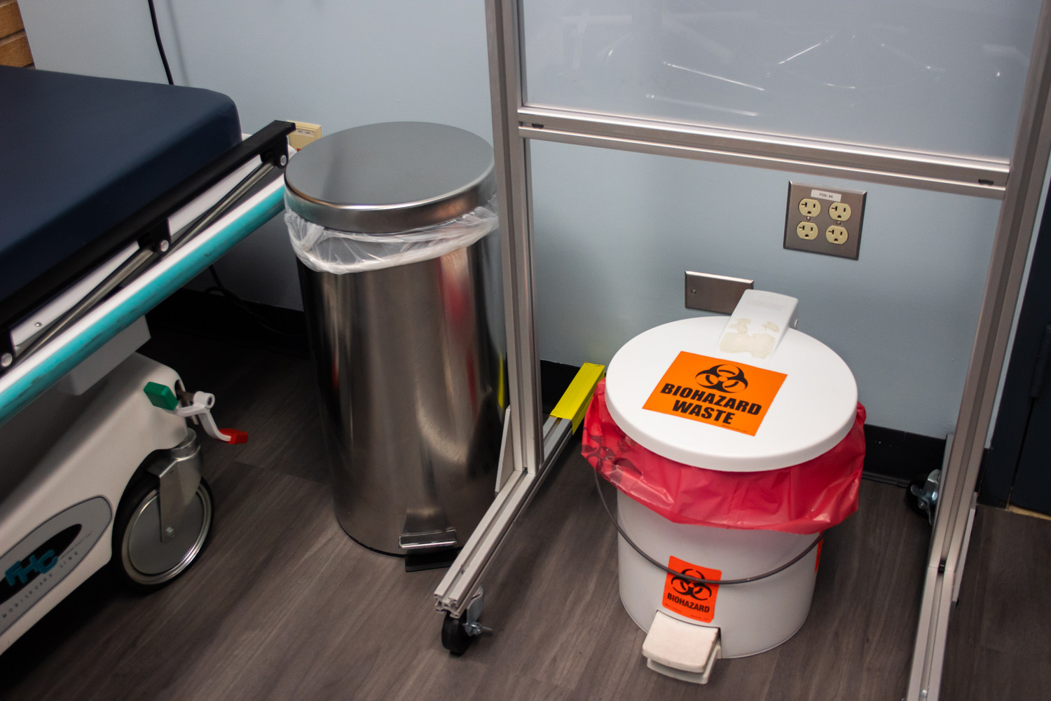 Bins are seperated to place normal trash from hazardous trash in ...